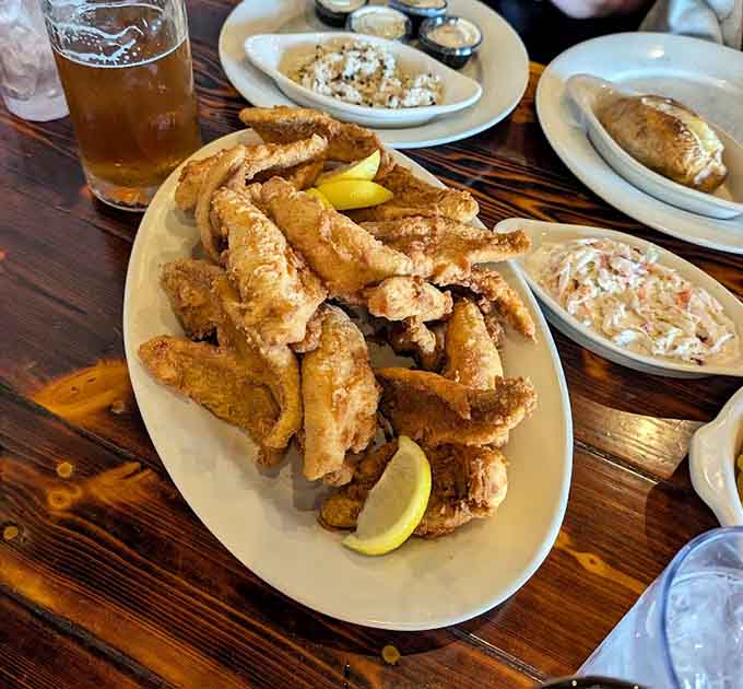 Golden fried walleye fillets arrive looking like they just won the lottery and want to share their fortune.