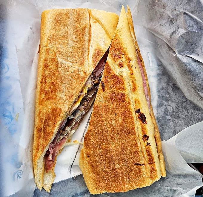 Architecture in sandwich form &ndash; layers of pork, ham, and cheese pressed to perfection between bread that shatters just right with each bite.