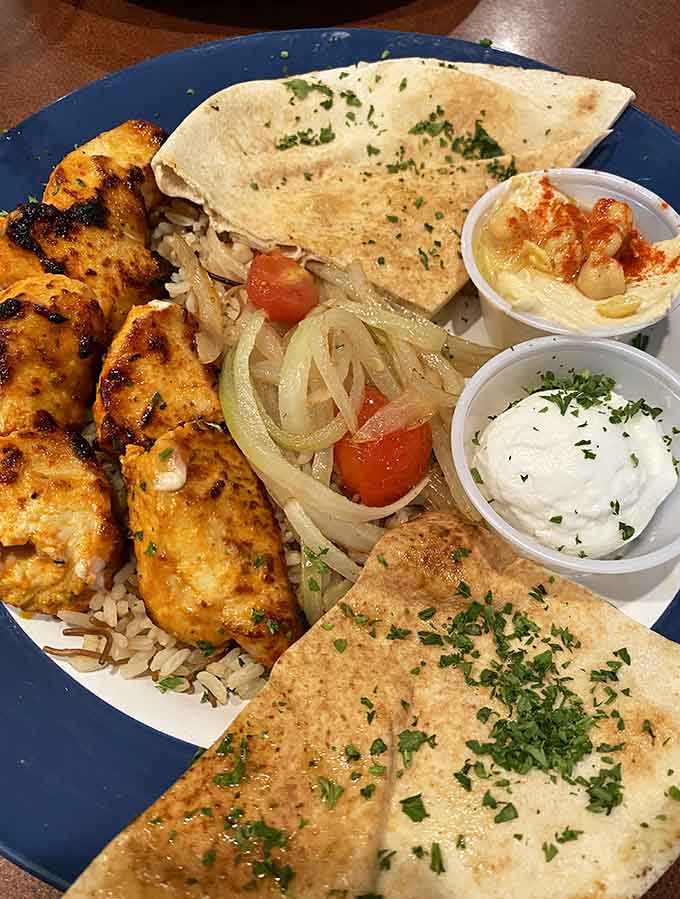 Perfectly charred chicken kabobs with hummus and pita prove that simple ingredients, properly prepared, need no apology.