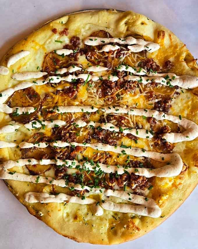 Behold the taco pizza in all its glory, where Mexican and Italian cuisines finally settle their differences deliciously.