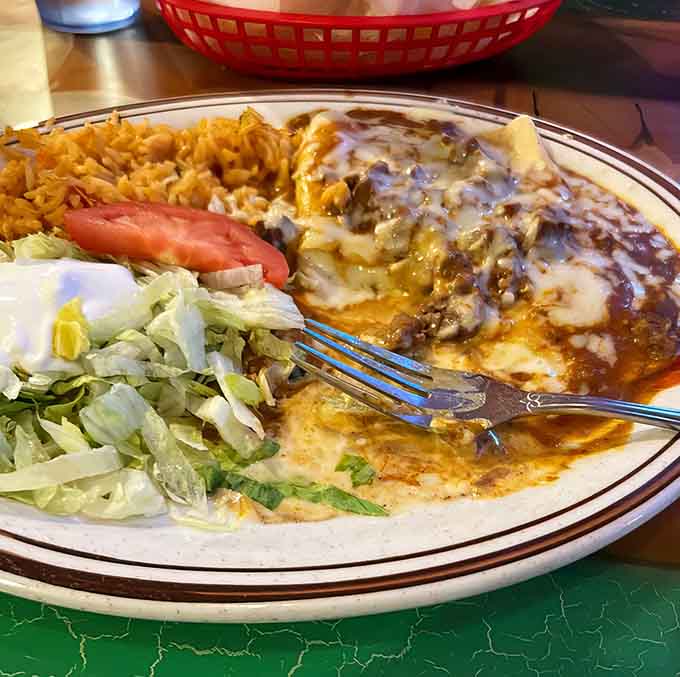 These enchiladas are what dreams are made of, smothered in sauce and melted cheese that stretches like it's showing off.
