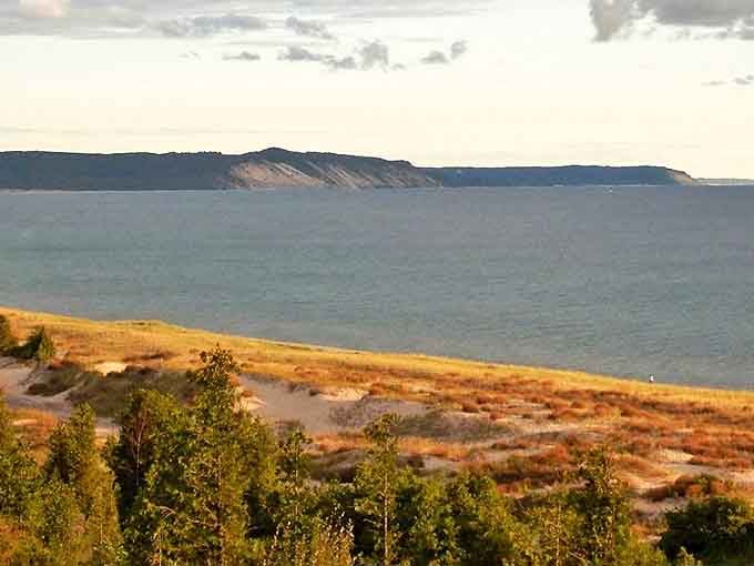 The majestic dunes of Elberta stand sentinel along Lake Michigan, their sandy slopes telling geological stories thousands of years in the making.