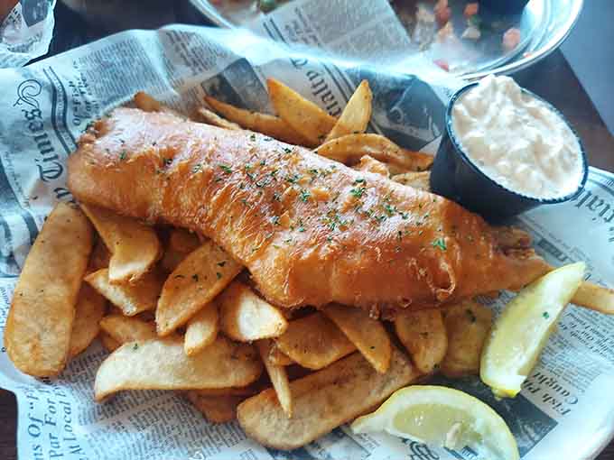 Behold the golden perfection that is their fish and chips, crispy battered fish piled high on fresh-cut fries like edible treasure.
