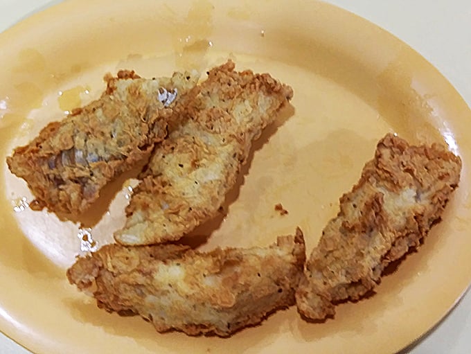 Golden-brown perfection! The Friday fish fry features a crackling crust that gives way to flaky white fish underneath.