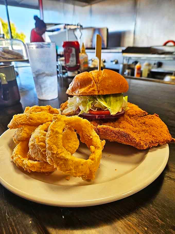 This isn't just a burger&mdash;it's architecture. Those onion rings deserve their own fan club and commemorative t-shirt.