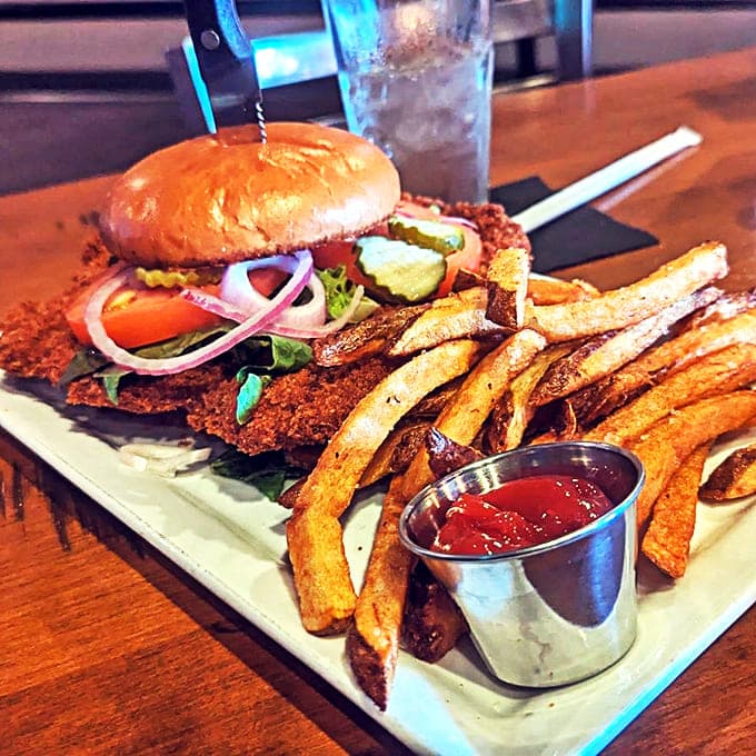 Crunch factor: 10/10! This golden-battered beauty sits proudly on its bun throne, surrounded by hand-cut fries that deserve their own fan club.