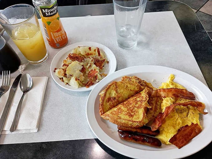 The breakfast of champions &ndash; golden French toast, perfectly scrambled eggs, and bacon cooked to that magical sweet spot between crisp and chewy.
