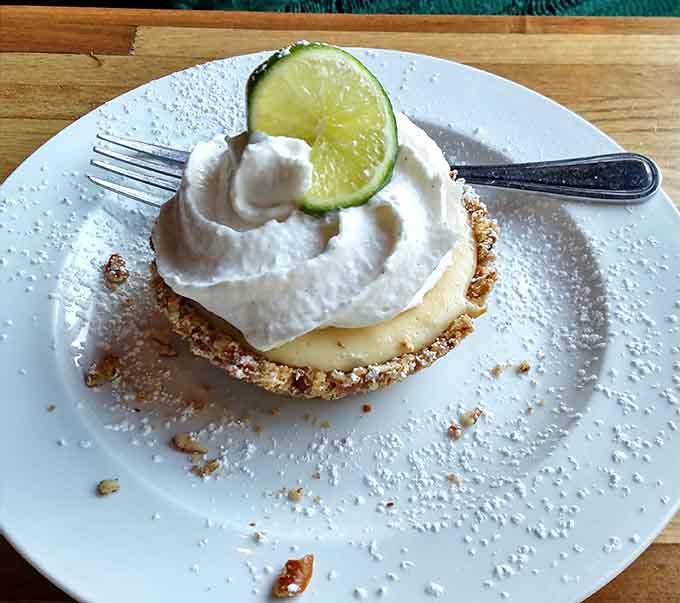 Behold the Key Lime Pie that launched a thousand road trips, complete with whipped cream and a lime slice crown.
