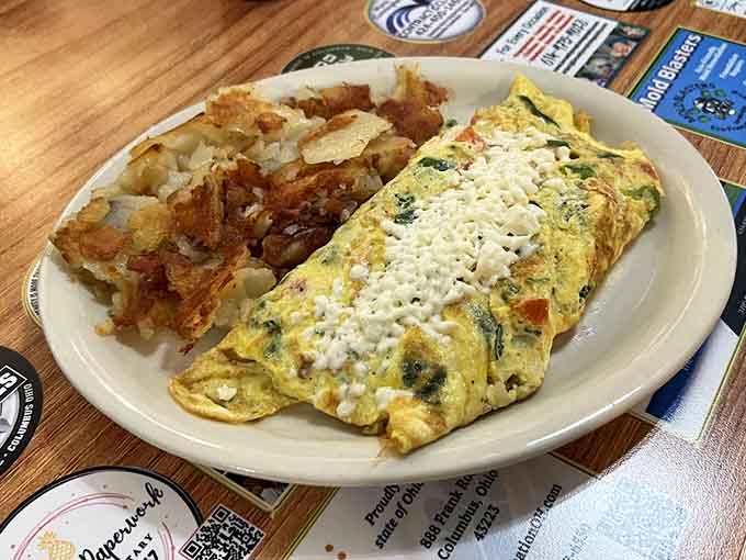 The legendary Reuben omelet combines corned beef, sauerkraut, and Swiss cheese into fluffy egg perfection that defies breakfast conventions beautifully.