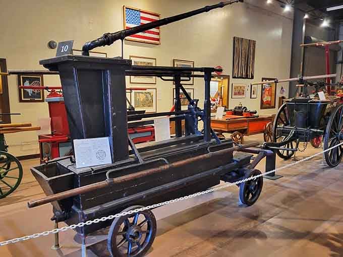 Hand-pumped fire engines like this beauty required serious teamwork and muscle power, making today's firefighters grateful for modern technology and hydraulics.