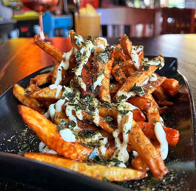 These aren't just fries, they're a tower of crispy, seasoned perfection that would make any food stylist weep with joy.