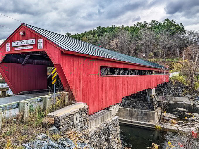 This crimson sentinel has stood watch for nearly two centuries, offering both passage across the river and perfect holiday card backdrops.