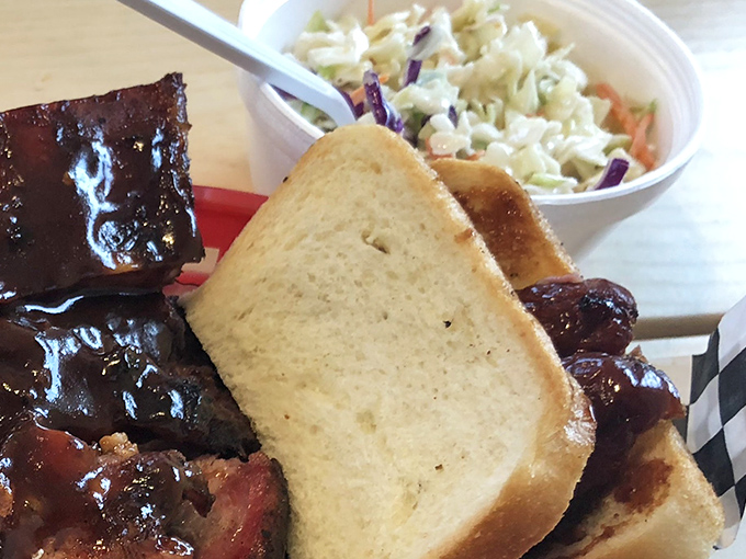 A perfect marriage: the Hot Link Sandwich with its spicy sausage nestled between bread, accompanied by creamy, crunchy coleslaw.
