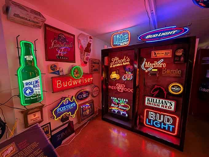 This wall of vintage beer signs represents countless happy hours and cold ones, each brand competing for attention like a neon popularity contest.