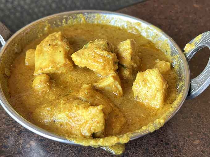 Golden chicken curry that's so aromatic and delicious, you'll be using your naan to chase every last drop of sauce around the bowl.