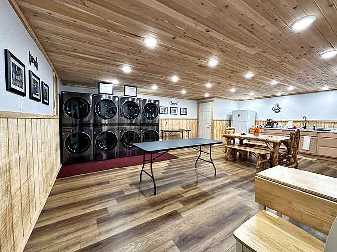Laundry day gets a rustic-chic makeover with modern machines in a warm, wood-paneled setting that makes even dirty clothes feel special.