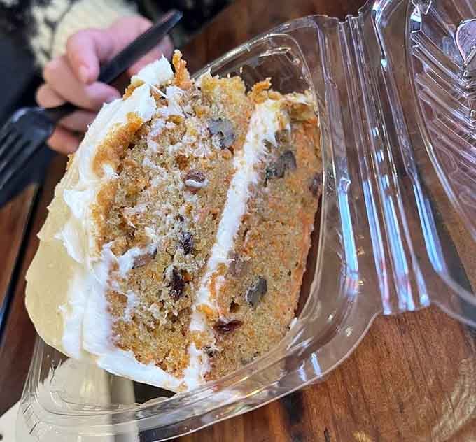 That carrot cake layer situation is no joke, stacked higher than your expectations and somehow exceeding them anyway.