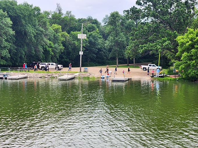 Families enjoying the swimming area prove that simple pleasures like splashing in a lake never go out of style, no matter what generation you're from.