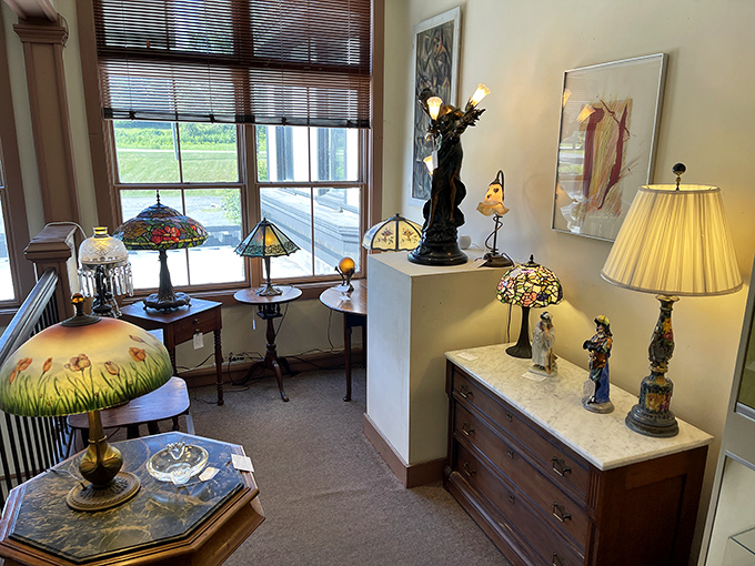 Tiffany-inspired lamps cast jewel-toned light across the showroom, each one a functional artwork waiting to illuminate someone's favorite reading nook.