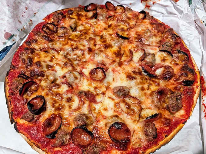 This isn't just pepperoni and sausage pizza &ndash; it's a masterclass in balance, with those perfectly curled meat cups holding pockets of flavor.