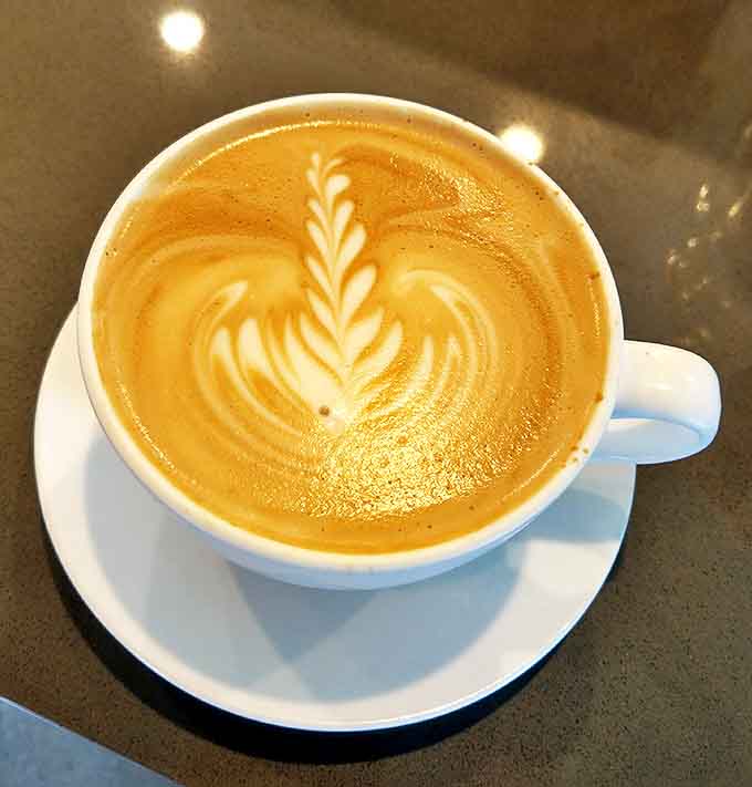 Latte art so pretty you almost feel guilty drinking it. Almost. The leaf design practically whispers, "Instagram me before the first sip."