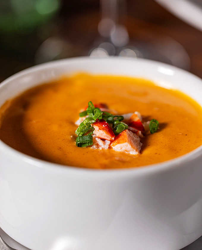 Lobster bisque that makes conversation stop mid-sentence &ndash; velvety, rich, and worth canceling your afternoon plans to savor slowly.