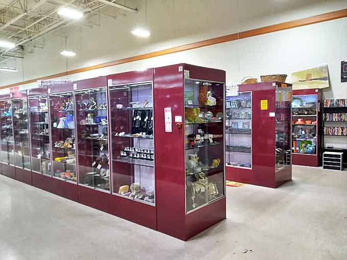 Glass showcases protect the more valuable collectibles from wandering fingers. Like a museum where everything has a price tag and a story.