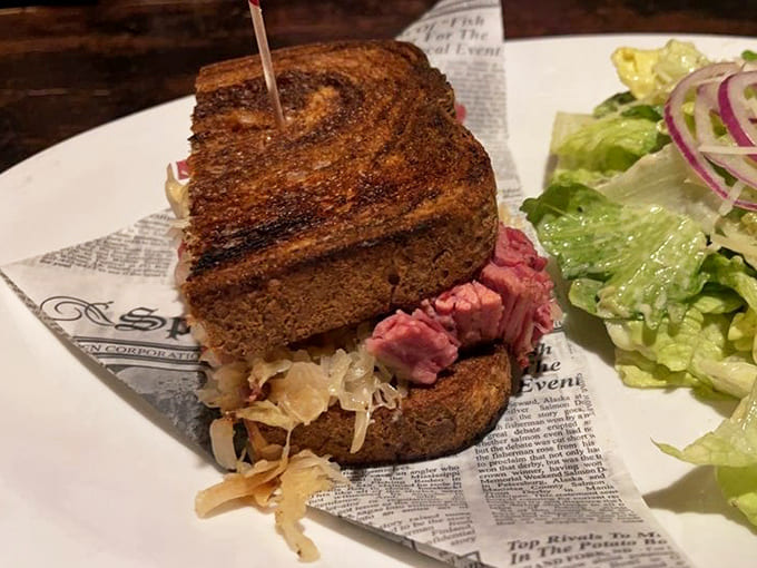 Behold the Classic Reuben in all its glory, stacked high with corned beef and grilled to crispy, melty perfection on marbled rye.