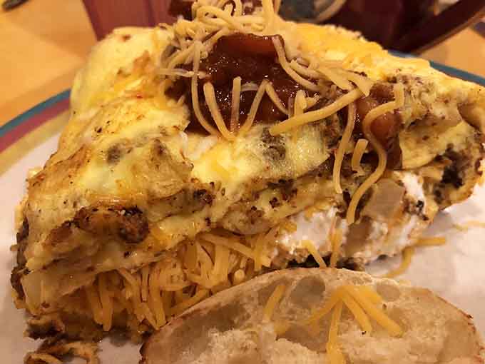 This isn't just any cheeseburger &ndash; it's architectural perfection with melted American cheese cascading over a juicy patty like a yellow waterfall.