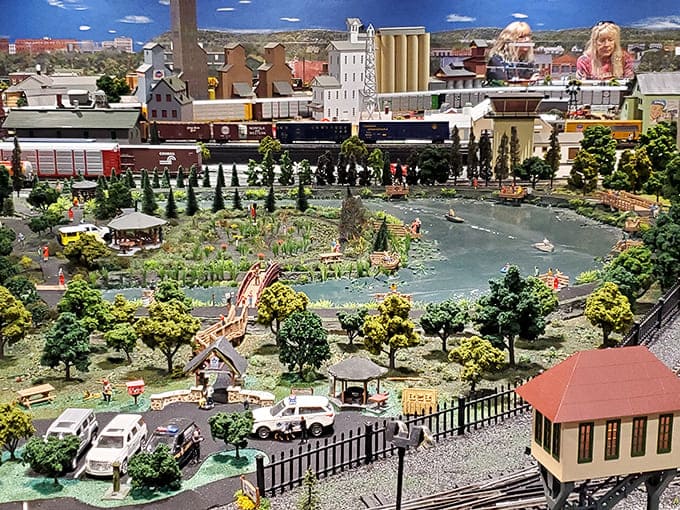 This peaceful park scene complete with glistening lake might make you wish you could shrink down for an afternoon picnic.