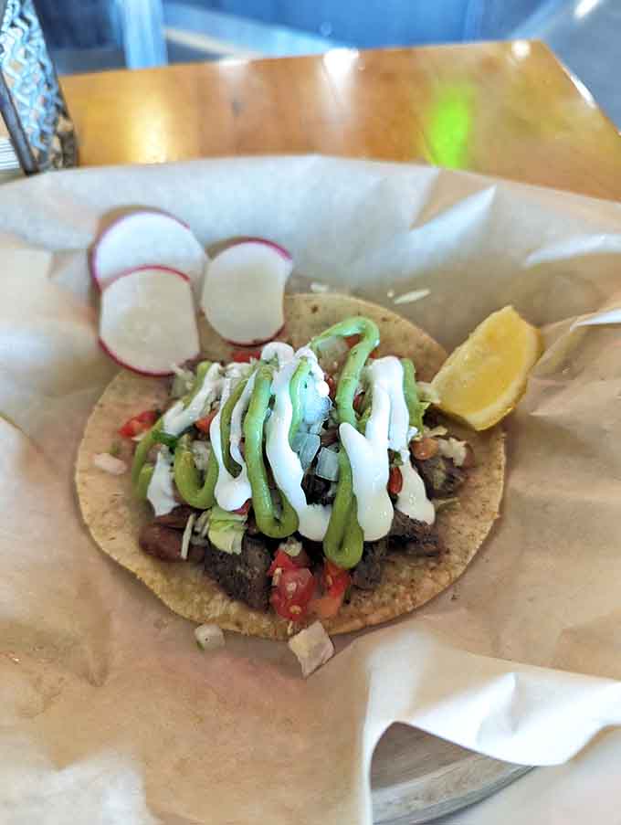 Carne asada perfection wrapped in a tortilla, garnished beautifully, and ready to change your burrito standards forever.