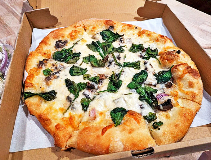 This isn't just mushroom pizza &ndash; it's a fungi festival with spinach joining the party. The gluten-free crust defies all expectations.