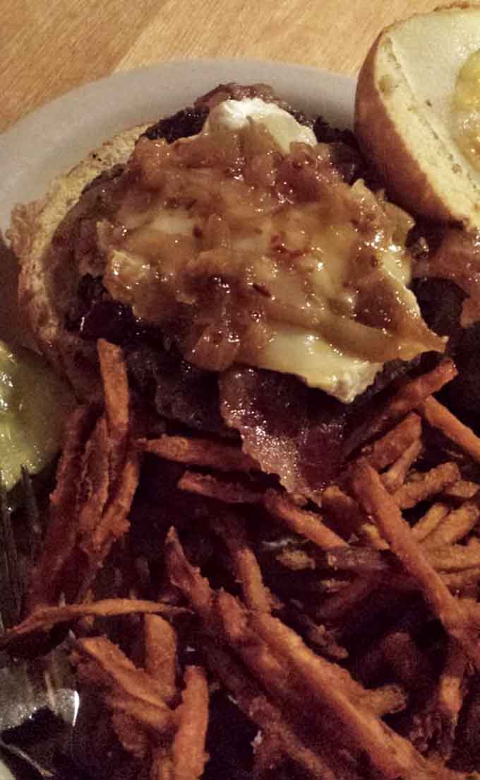 Behold the bison burger in all its glory, juicy and perfectly cooked, ready to change your burger standards forever.