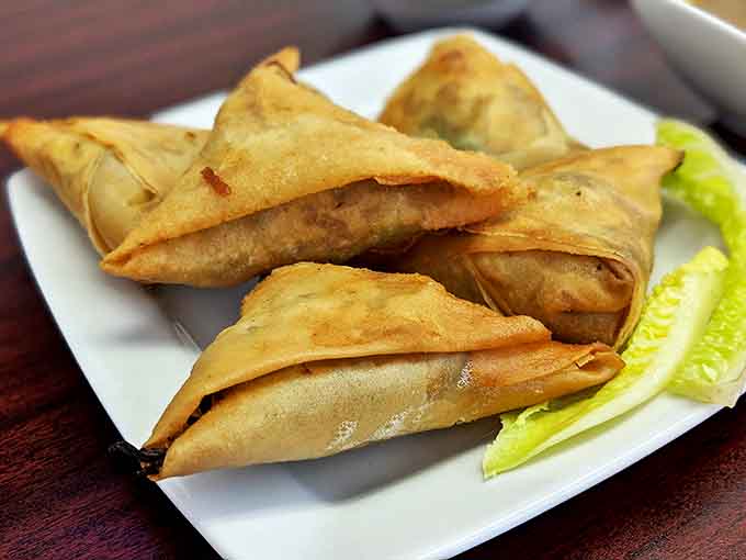 Golden-fried samosas that shatter with each bite, revealing a savory interior that makes you wonder why you ever settled for frozen appetizers.