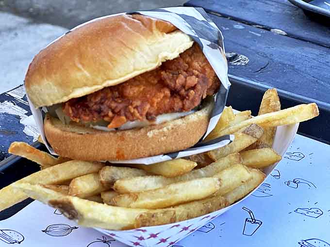 Chicken Sandwich: The legendary crispy chicken sandwich that launched a thousand road trips, paired with golden fries that deserve their own fan club.
