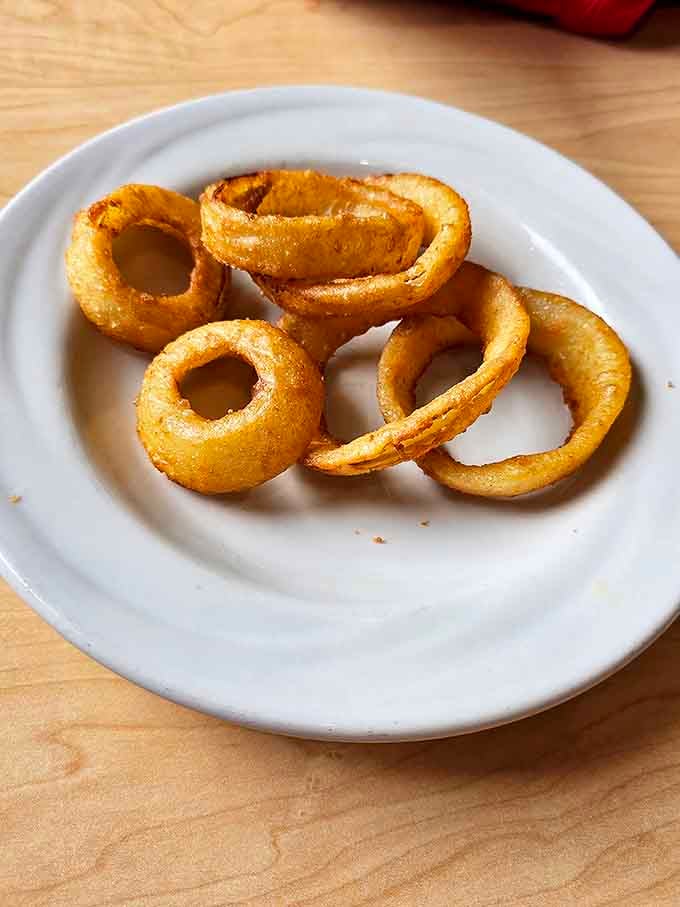 Golden halos of crispy perfection that make other onion rings seem like distant, less-talented cousins. These rings don't just set the bar, they are the bar.