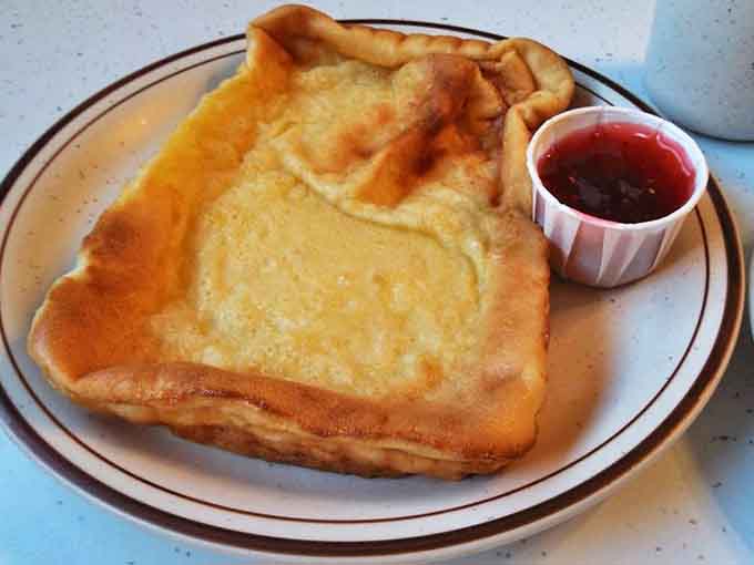 Behold the legendary pannukakku with raspberry sauce – a custardy Finnish pancake that makes ordinary breakfast seem like a tragic missed opportunity.