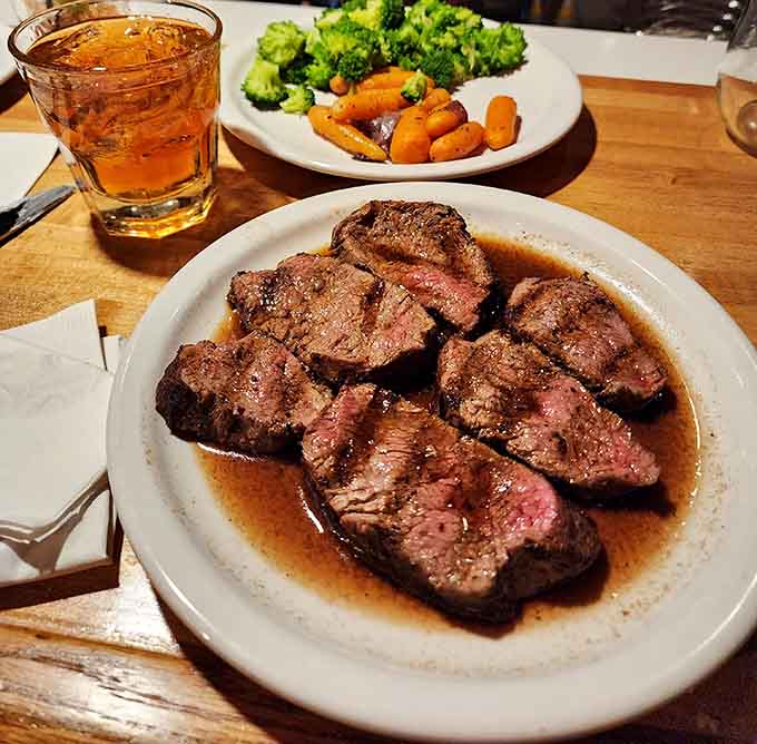 Perfectly seared and sliced steak reveals that gorgeous pink interior that makes carnivores weak in the knees with pure joy.