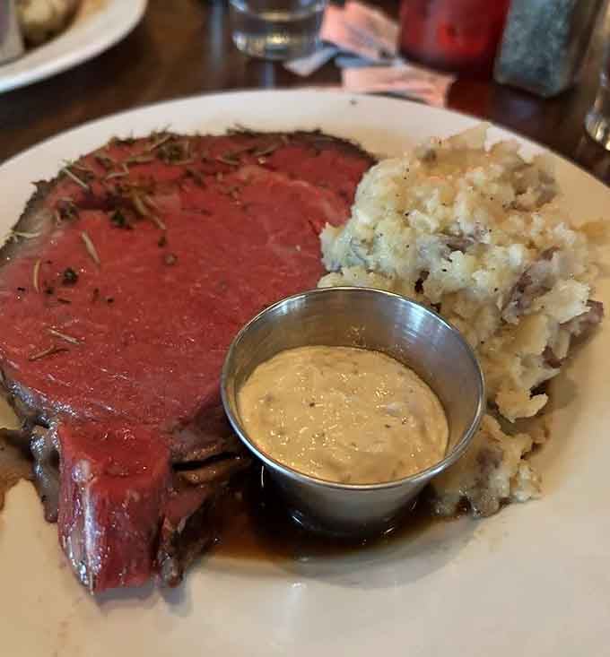 Behold the prime rib in all its glory, pink-centered perfection with a side of horseradish that means serious business.