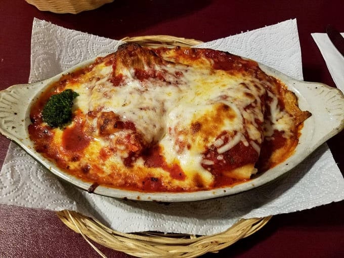 Behold the chicken parmesan in all its bubbling glory! That golden cheese crust should be declared a national treasure.