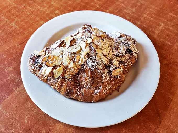 This almond croissant isn't just breakfast&mdash;it's a religious experience. Flaky, buttery layers cradle rich almond filling in perfect harmony.