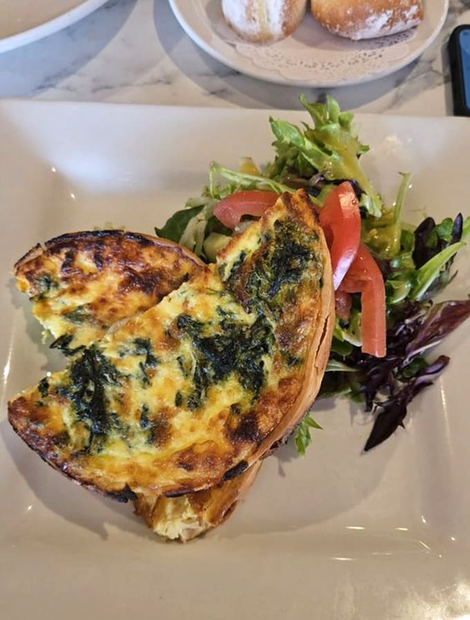 Spinach quiche that makes Popeye's dietary choices suddenly make perfect sense, golden and gorgeous in its pastry shell.