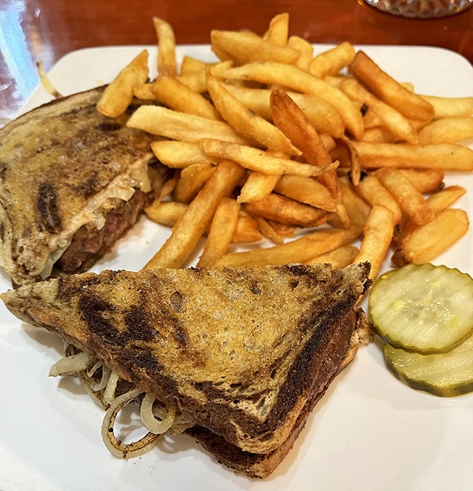 This patty melt isn't playing games &ndash; perfectly grilled rye bread, melted cheese, and caramelized onions create sandwich perfection.