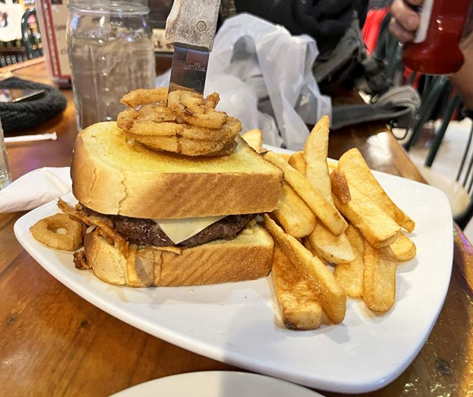 This isn't just any patty melt – it's a masterclass in melted perfection with Swiss cheese cascading over a juicy beef patty.