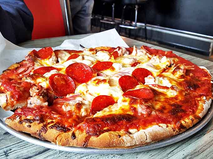 This isn't just pepperoni pizza; it's a masterclass in perfect proportions &ndash; those cup-and-char pepperoni edges crisping into flavor vessels that'll haunt your dreams.