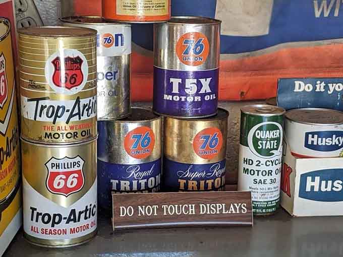 Motor oil cans from brands you've never heard of create a colorful timeline of American petroleum history, their bold graphics putting modern packaging to shame.