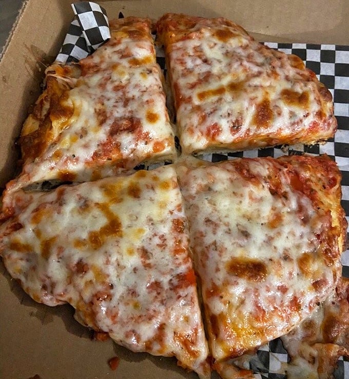 The benchmark of any great pizzeria &ndash; a perfect cheese pizza with that ideal balance of sauce, cheese, and a crust that's both crisp and chewy.