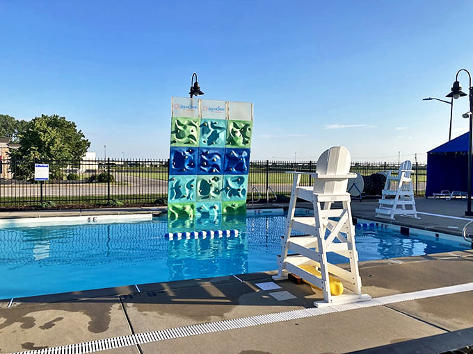 Challenge yourself on the poolside climbing wall, where falling means landing in refreshing waters rather than embarrassment.