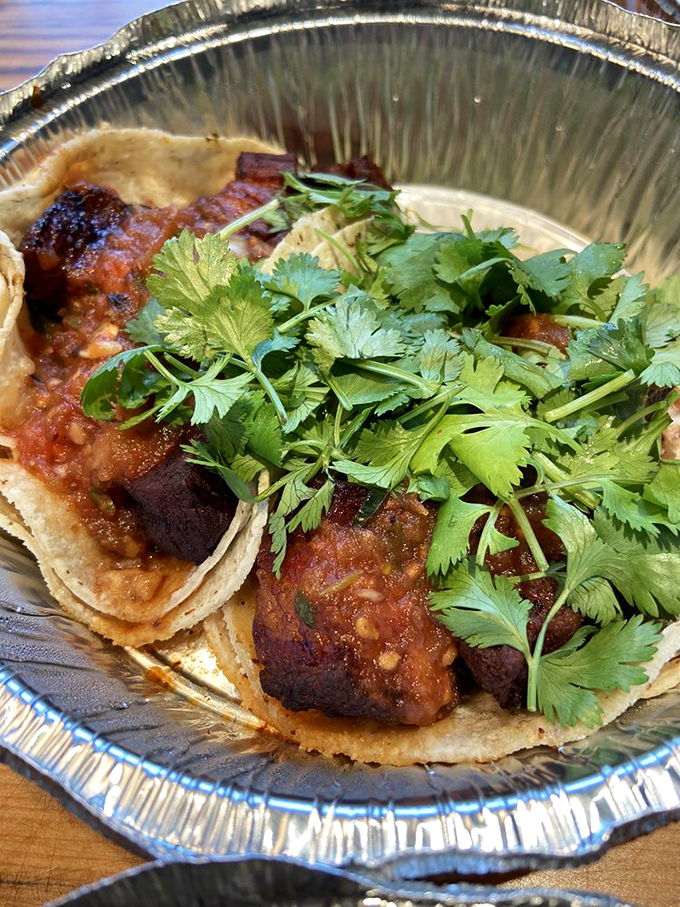 Crispy-edged, melt-in-your-mouth pork belly nestled in a fresh tortilla with bright cilantro &ndash; a handheld masterpiece worth traveling for.