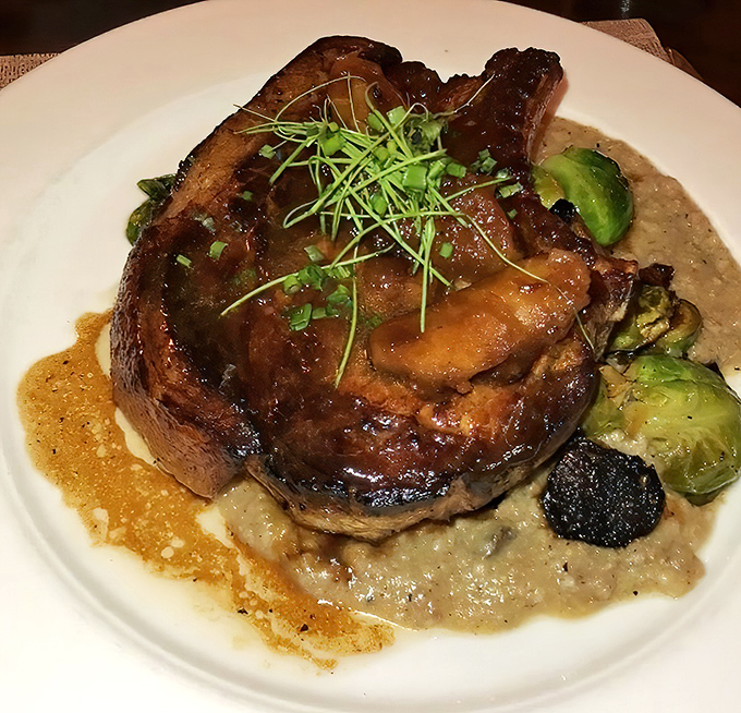 This isn't just any pork chop &ndash; it's a masterpiece of heritage breeding and perfect cooking, resting on creamy garlic mash with seasonal vegetables.